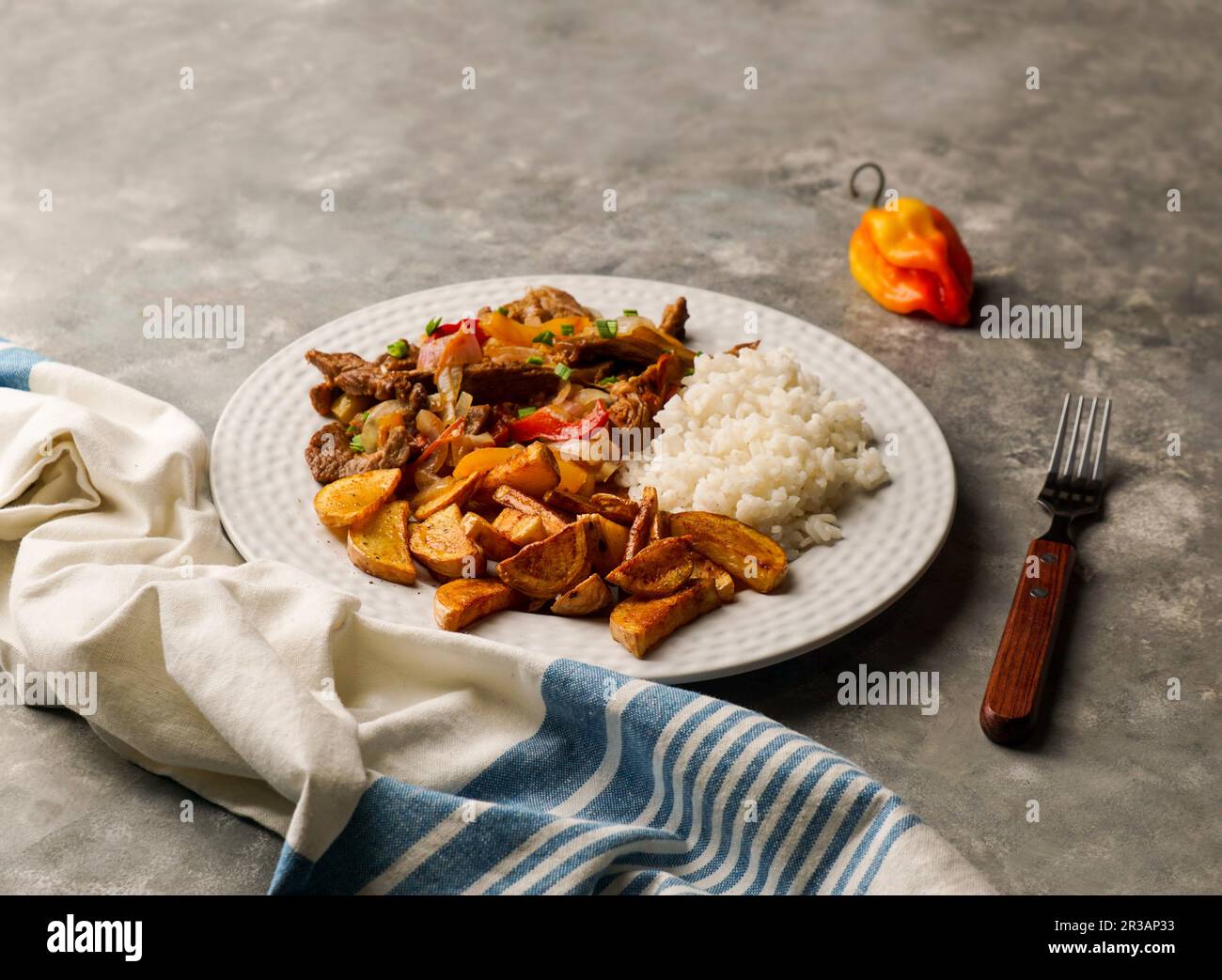 Lomo saltado - Peruvian beef tenderloin with red onions, yellow chili ...