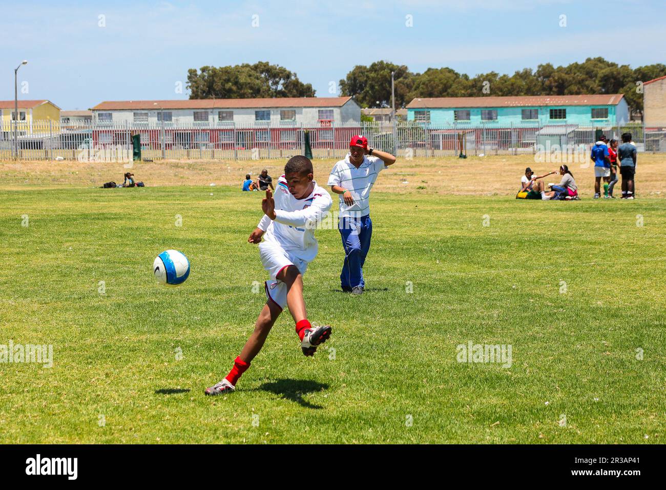 Diverse children playing soccer football at school Stock Photo - Alamy