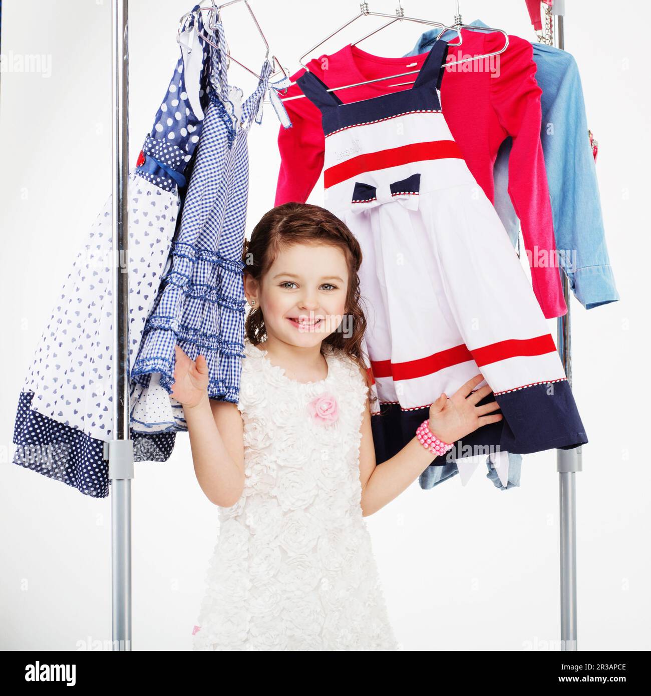 Little woman trying new clothing on white background. Small girl ...