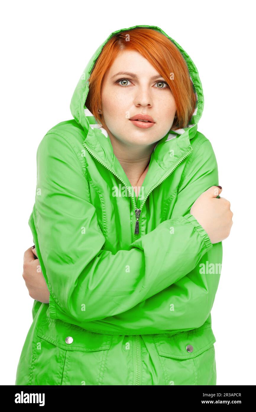 Portrait of a girl in a jacket with a trembling from the cold Isolated ...