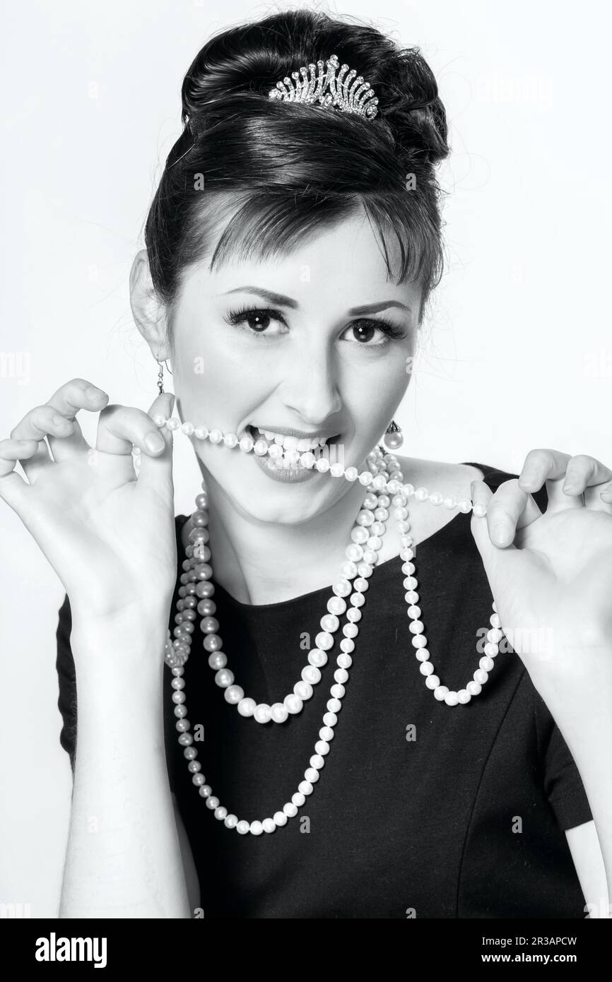 Portrait of a beautiful young woman in retro style in the image of the ...