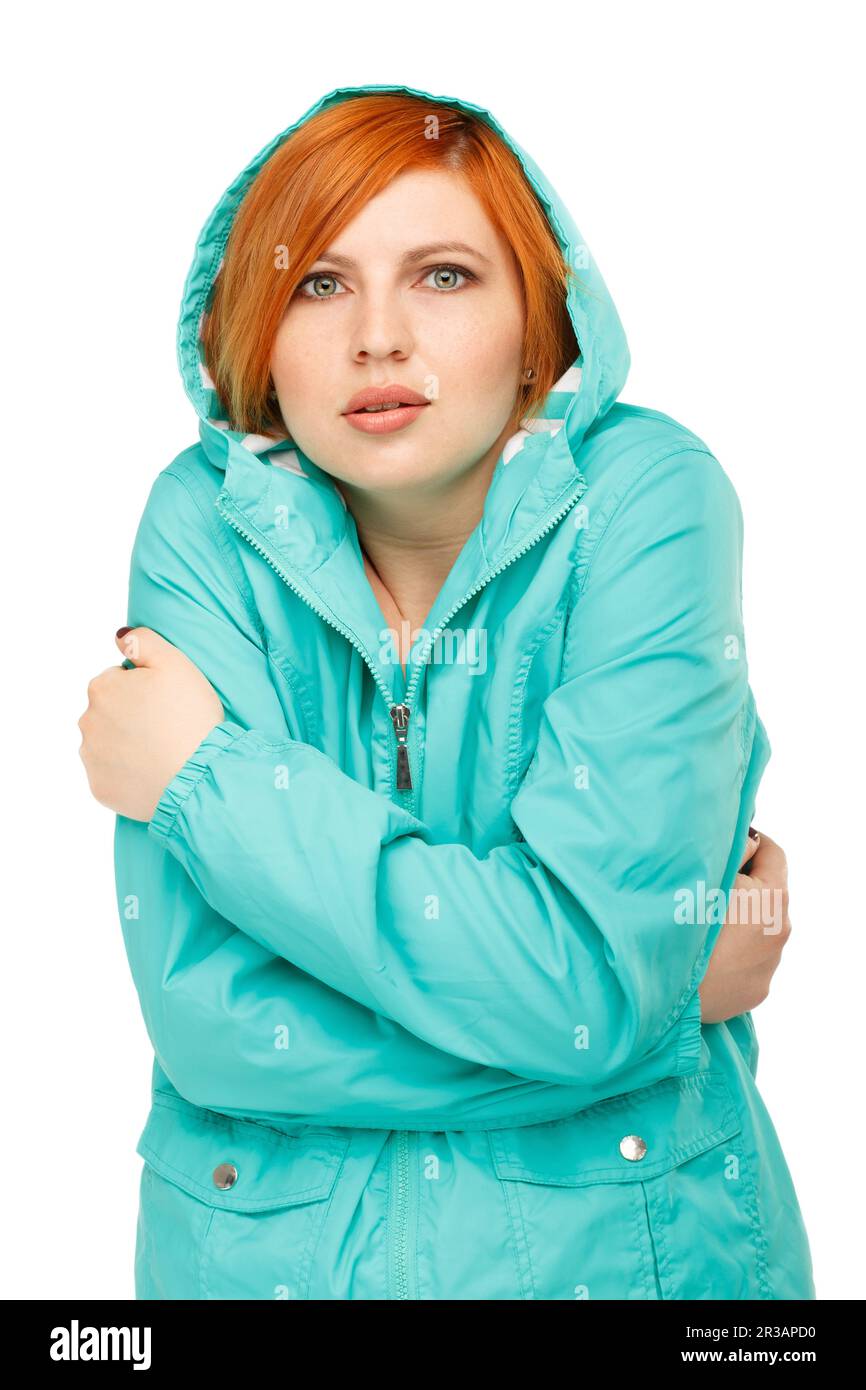 Portrait of a girl in a jacket with a trembling from the cold Isolated ...