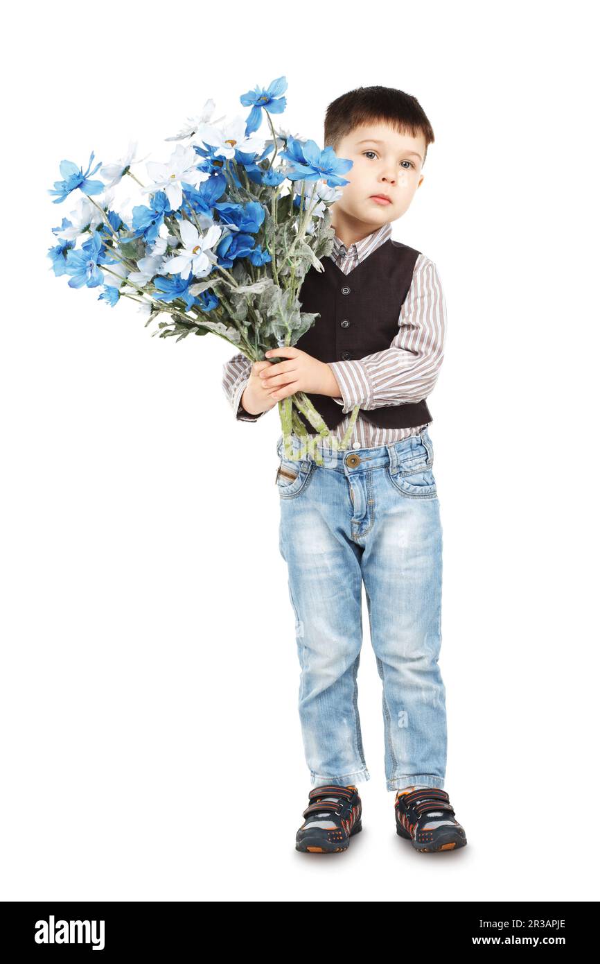 Funny little boy holding a large bouquet of flowers isolated on white ...