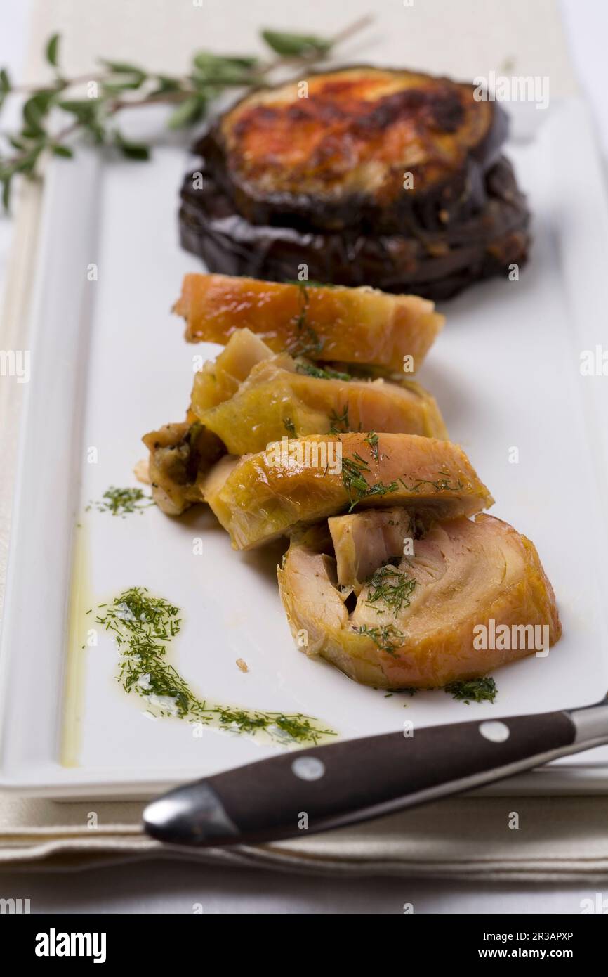 Rabbit roulade with an aubergine bake and salsa verde Stock Photo - Alamy
