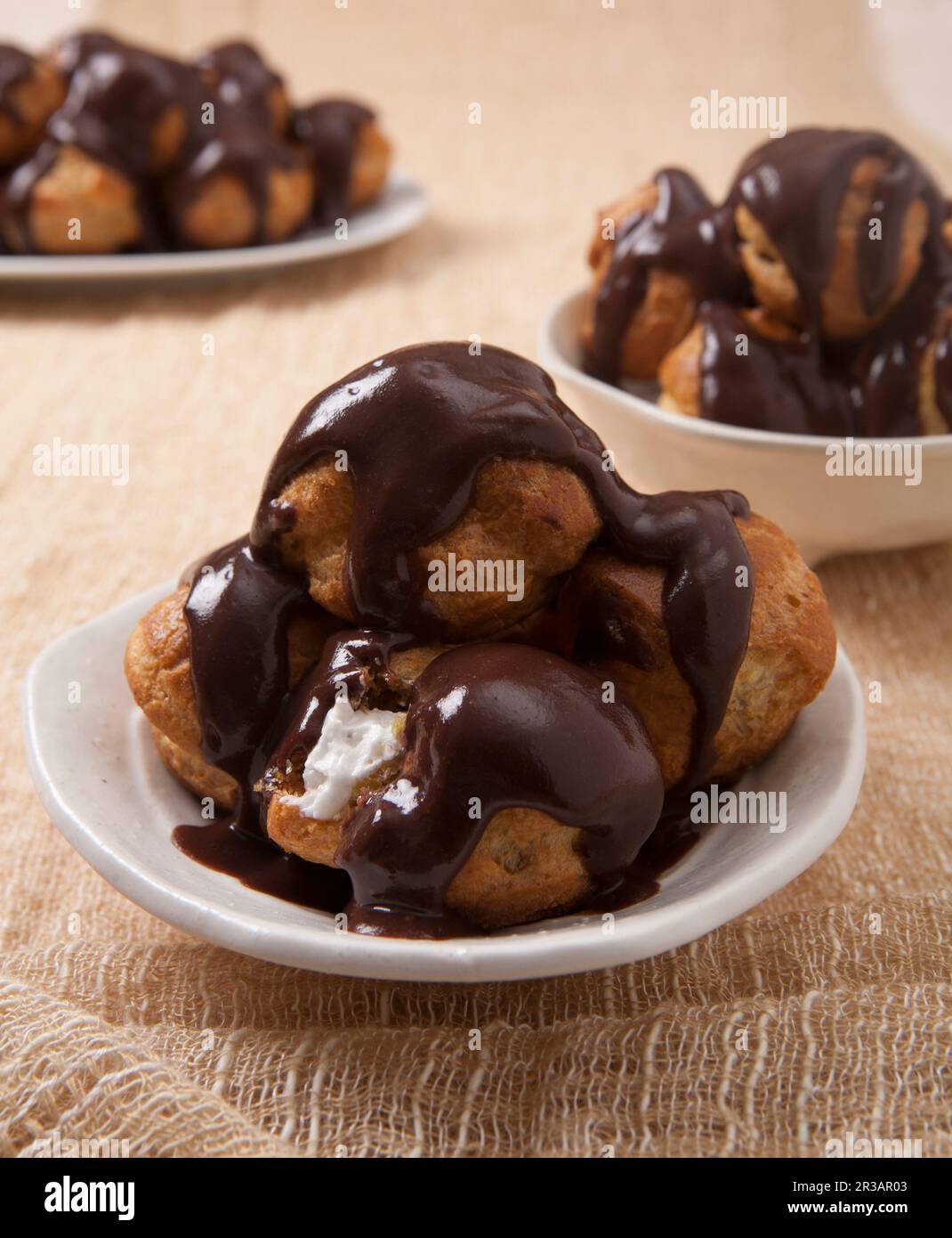 Plate chocolate profiteroles close hi-res stock photography and images ...