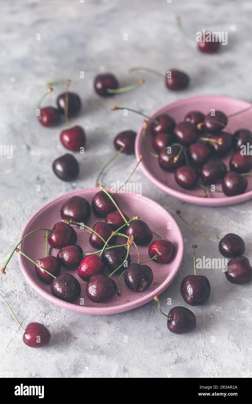 Fresh cherries on plates Stock Photo - Alamy