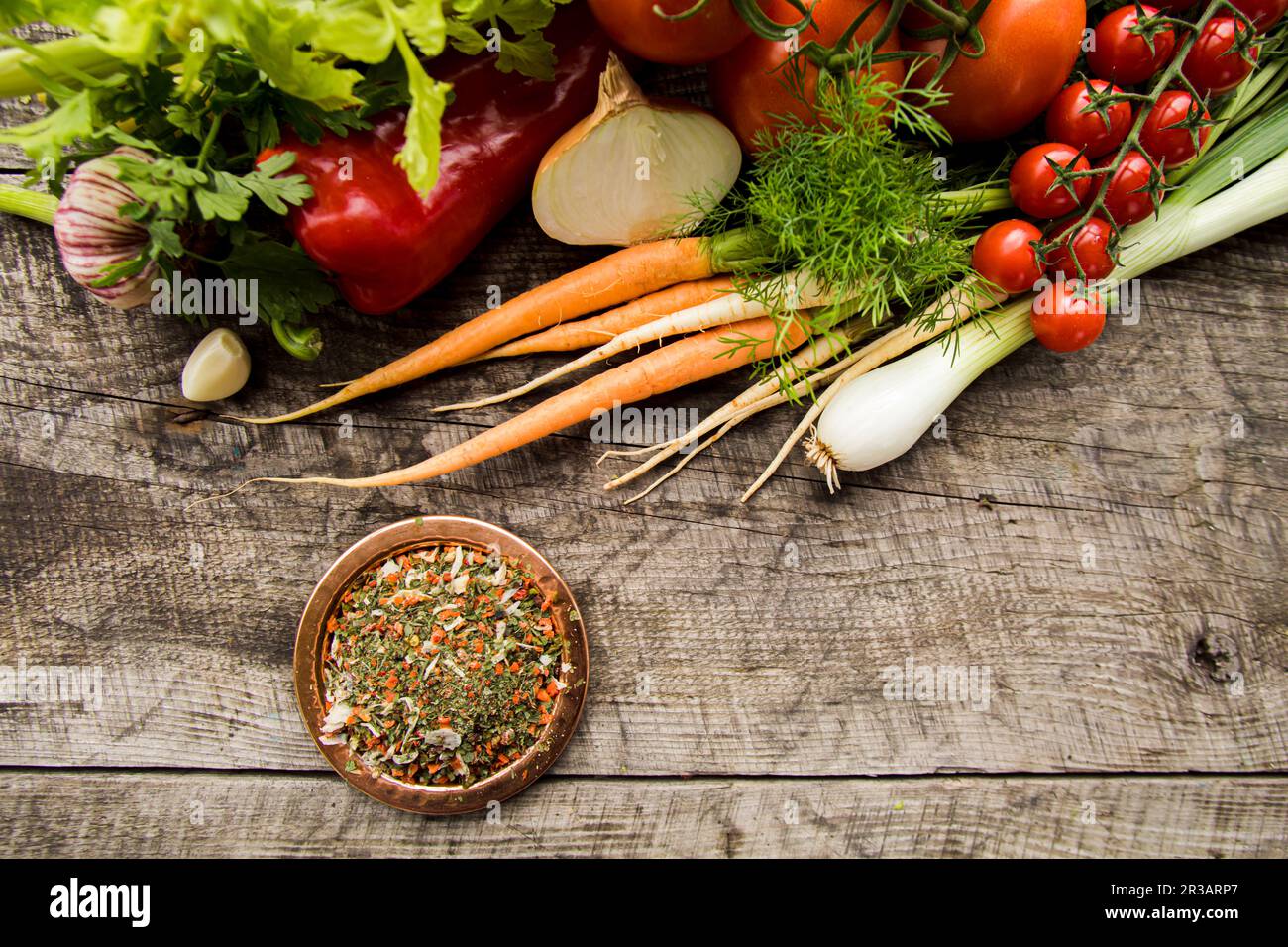 Plate with spice mix and fresh vegetables, ingredients for seasoning ...