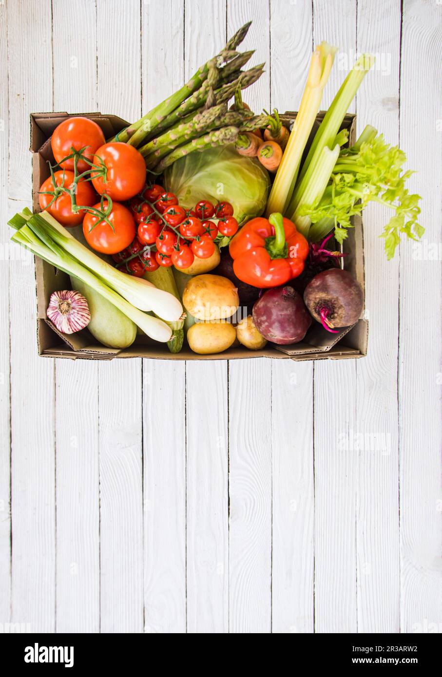 Variety of fresh vegetables in wooden box hi-res stock photography and ...