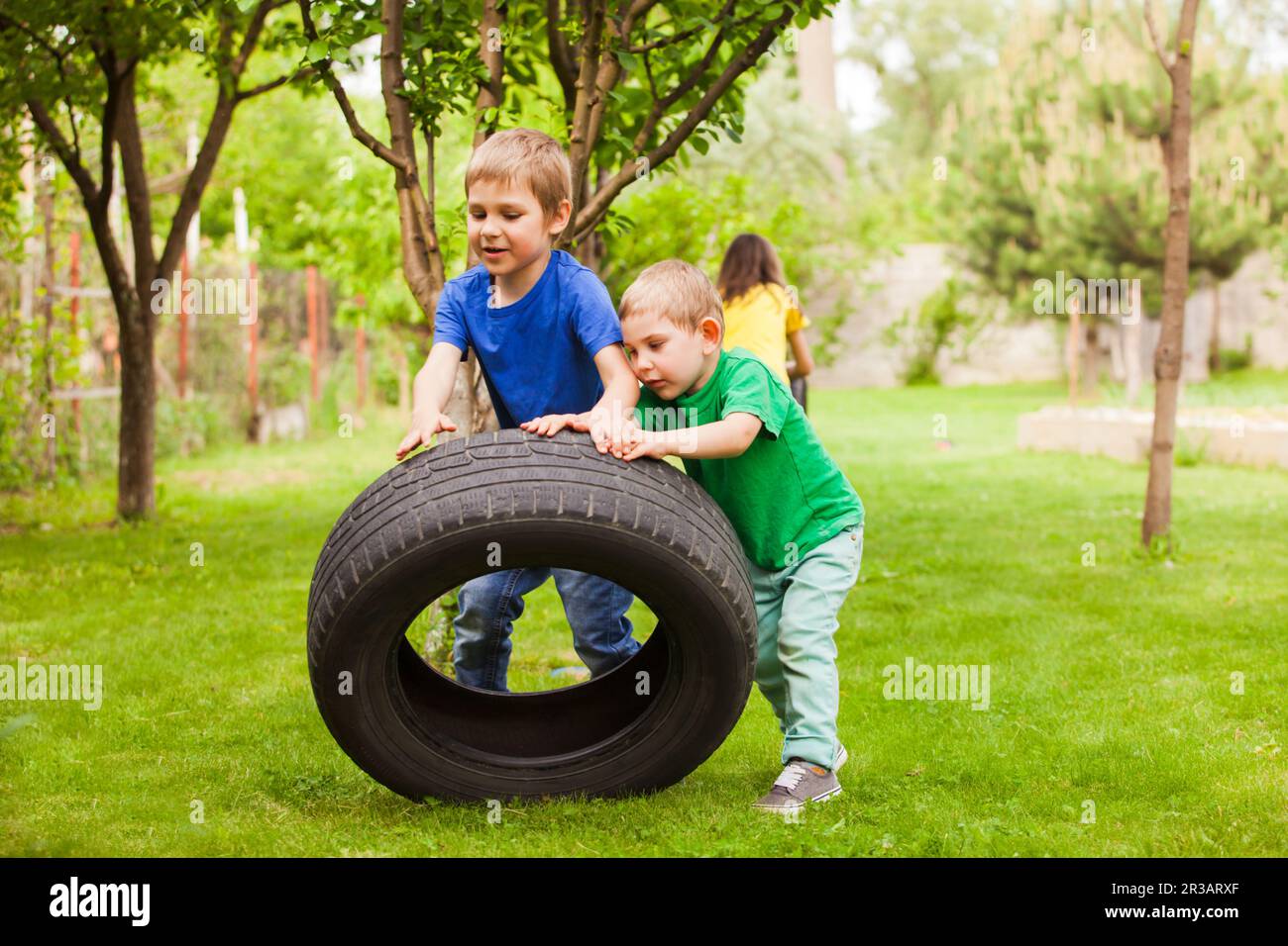 The little boys develop physical strength using improvised things Stock ...