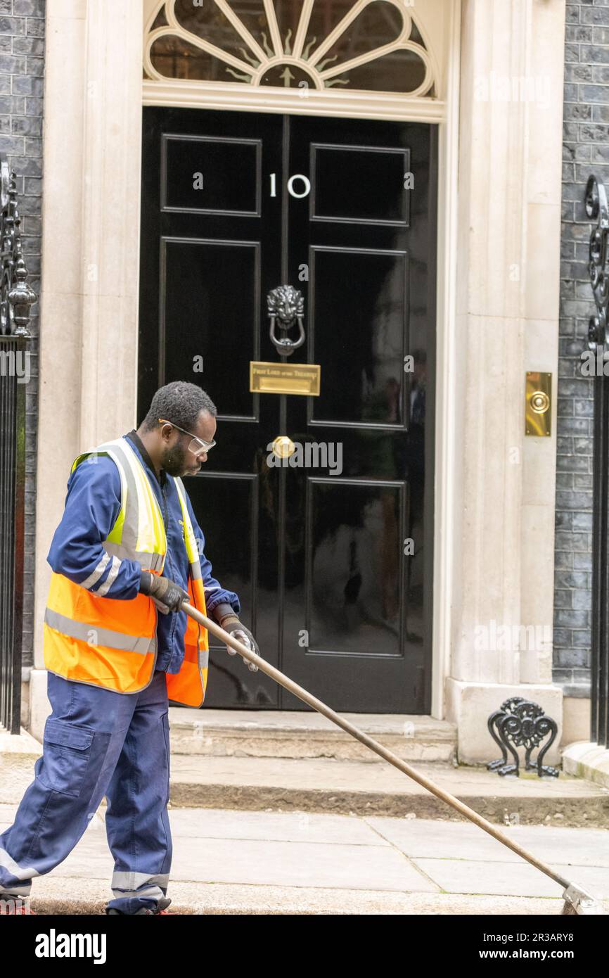 London, UK. 23rd May, 2023. Street sweeper at 10 Downing Street London ...