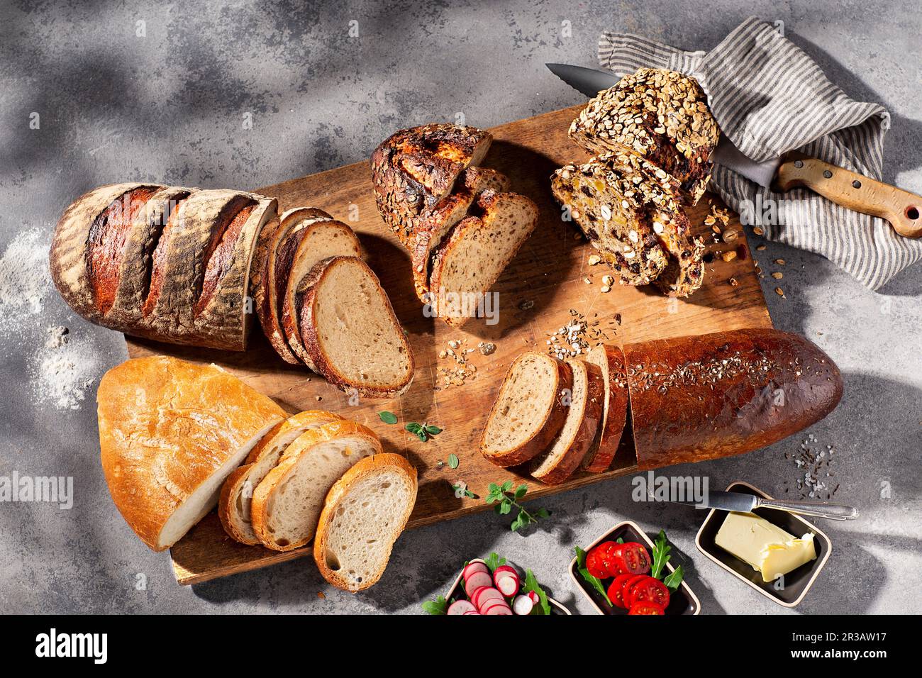 A bread buffet on a chopping board Stock Photo - Alamy
