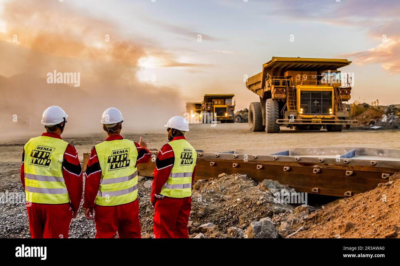 Large Dump Trucks transporting Platinum ore for processing with mining ...