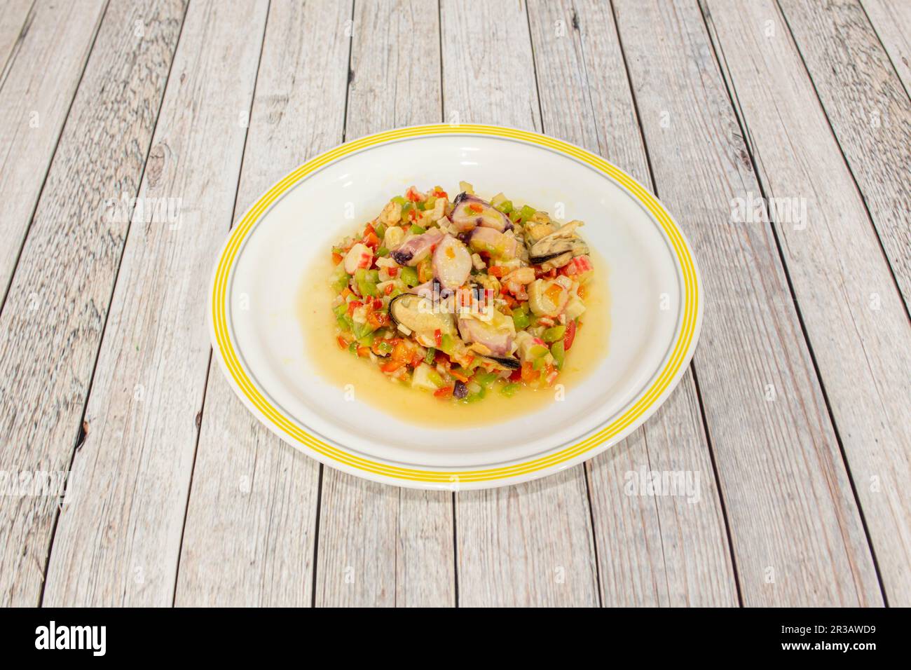 Seafood splash. Fish or seafood dish cut into pieces marinated with ...