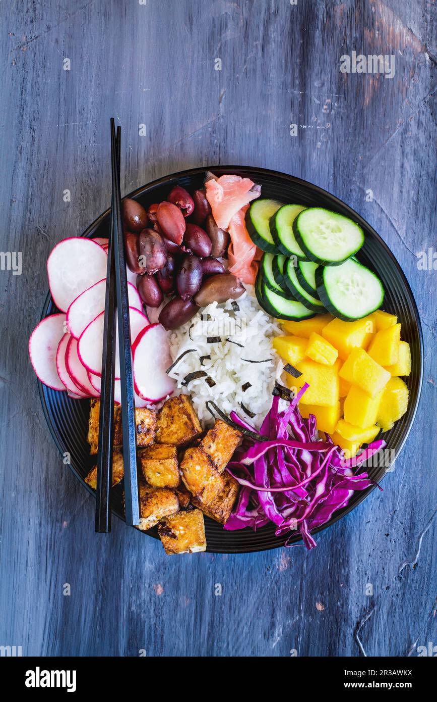 Buddha bowl with basmati rice, mango, fried tofu, purple cabbage ...