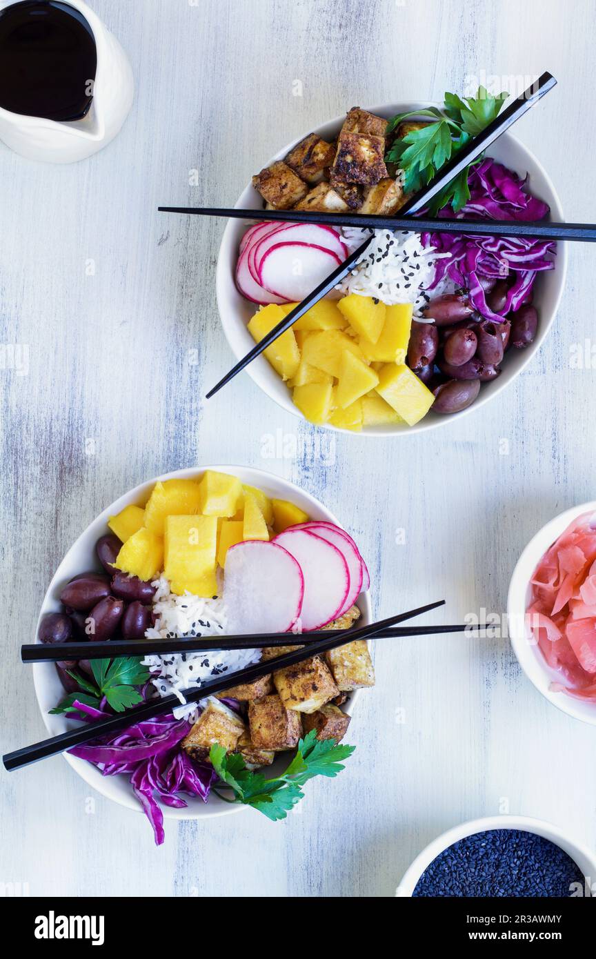 Vegan poke bowl with basmati rice, mango, fried tofu, purple cabbage ...