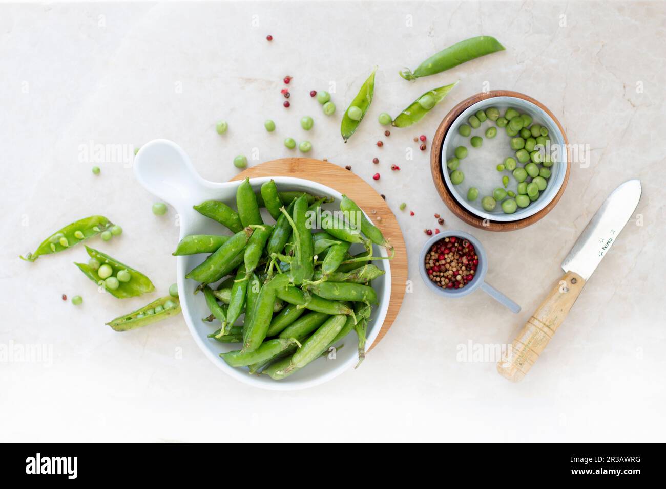 Fresh peas in pods and chopped Stock Photo - Alamy