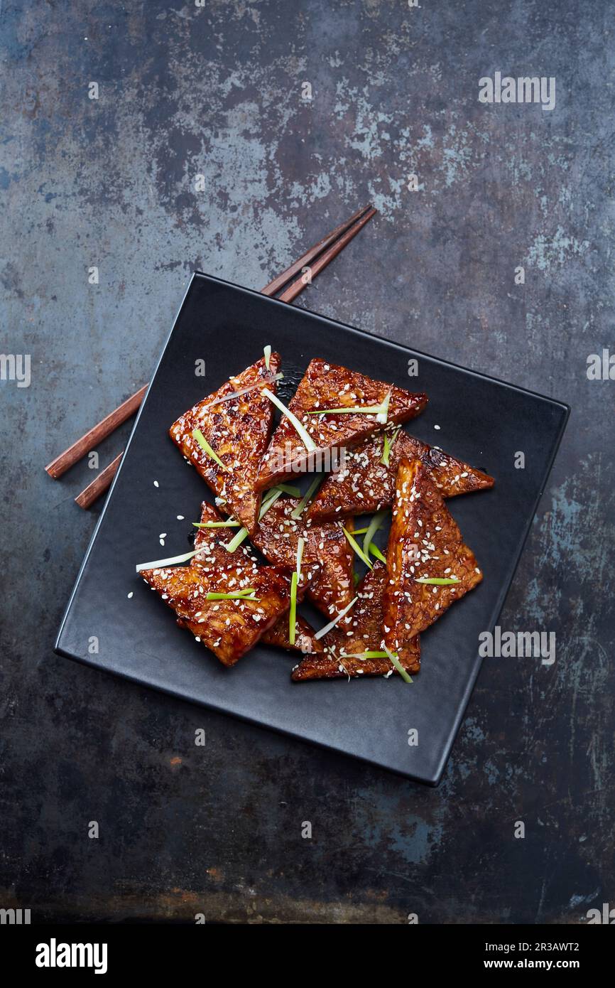 Teriyaki marinated Tempeh with Sesame seeds Stock Photo - Alamy