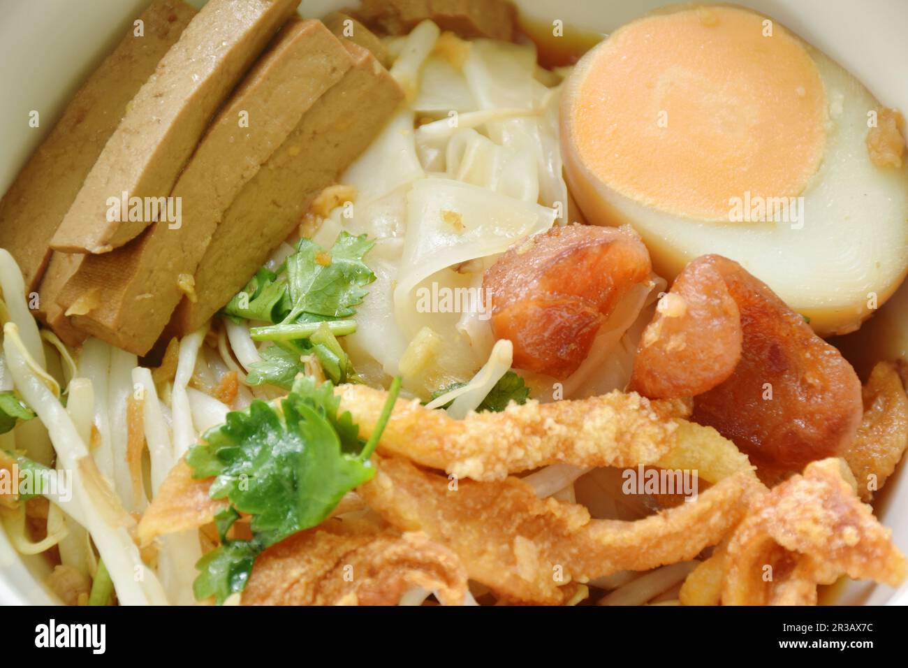 steamed large rice noodles topping slice fried Chinese sausage and pork ...