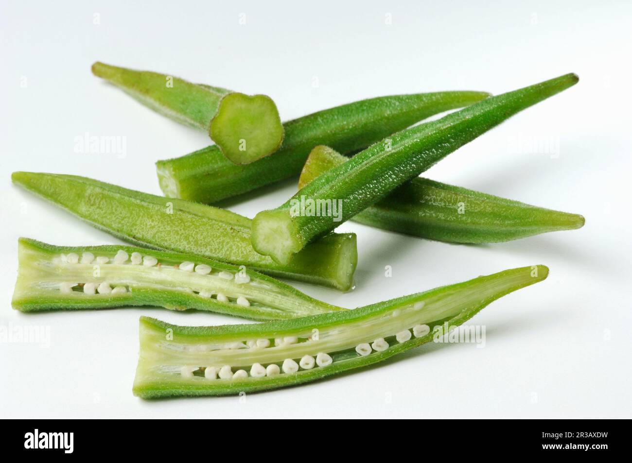 Fresh okra pods on a white background Stock Photo - Alamy