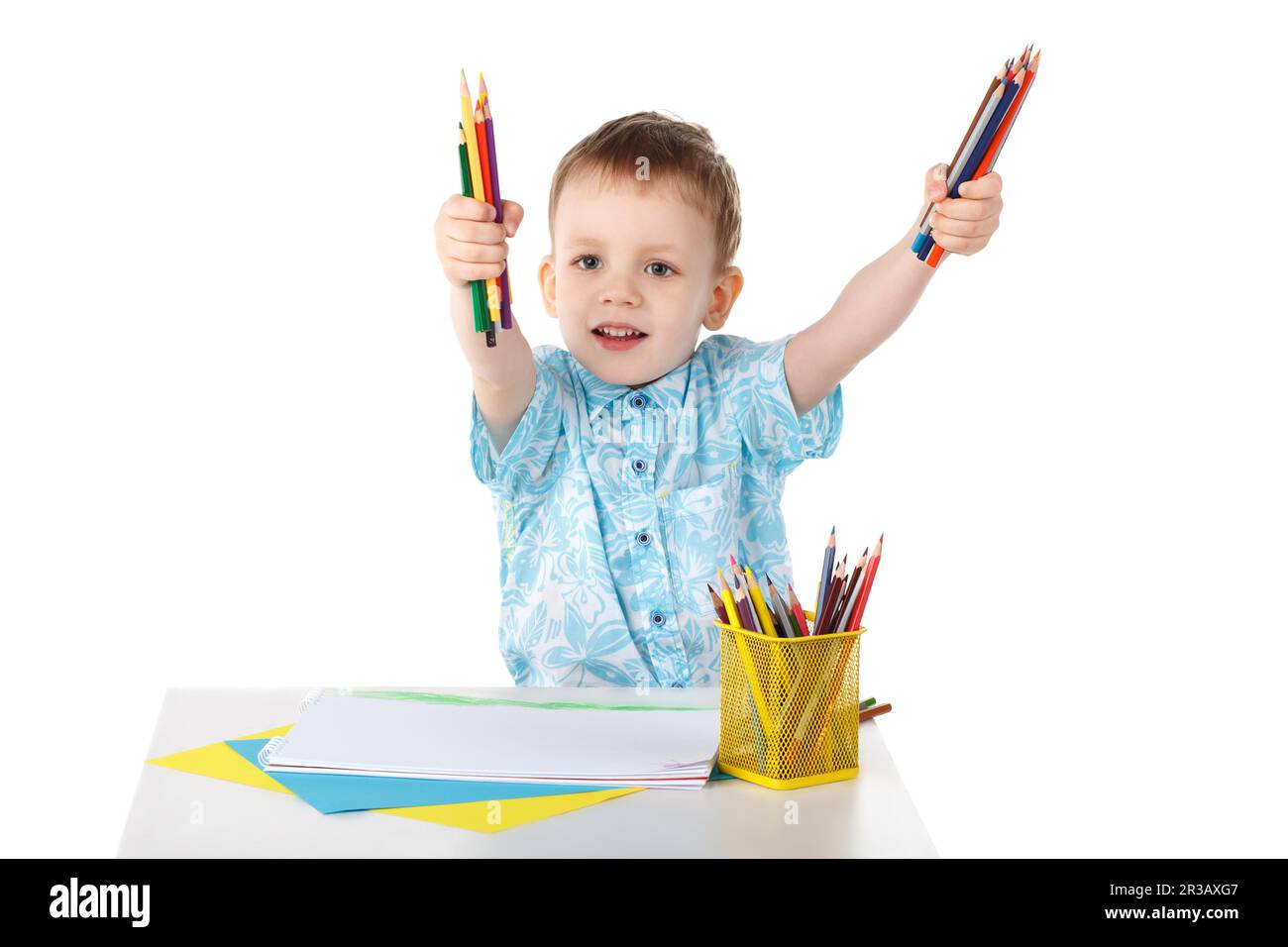 Little boy holding a lot of colored pencils isolated on white ...