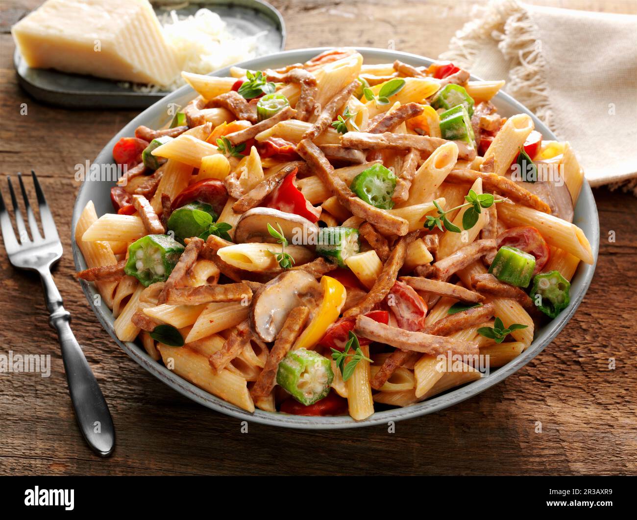 Cajun Style Andouille pasta with okra and cherry bomb peppers Stock ...
