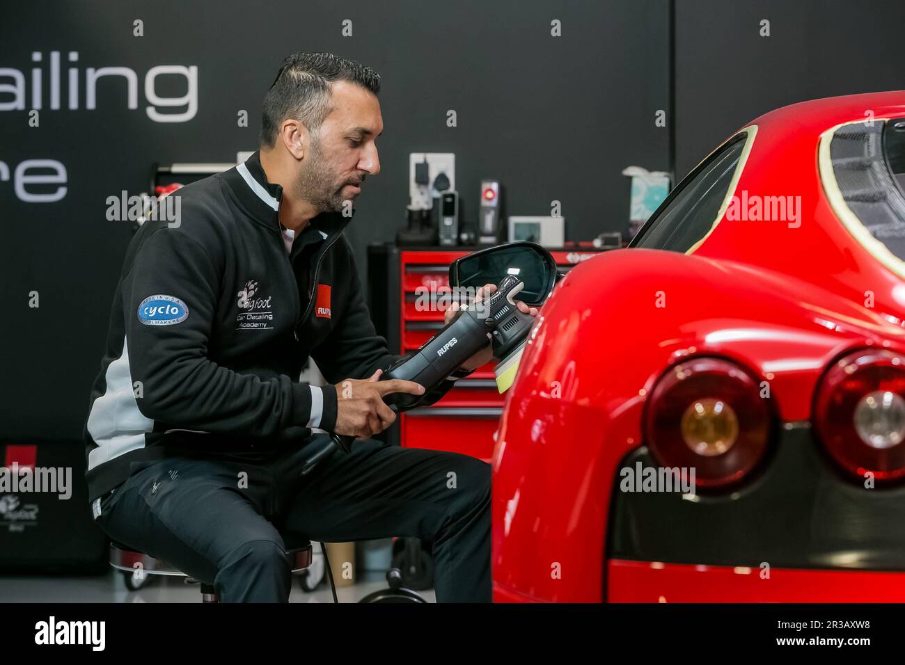 Professional motor vehicle detailing being done to luxury sports car ...