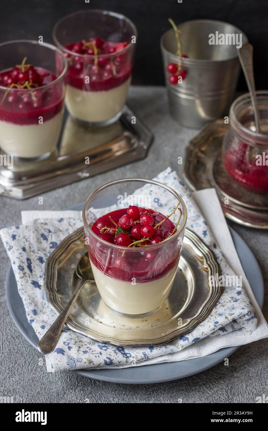 White chocolate panna cotta with redcurrant sauce Stock Photo - Alamy