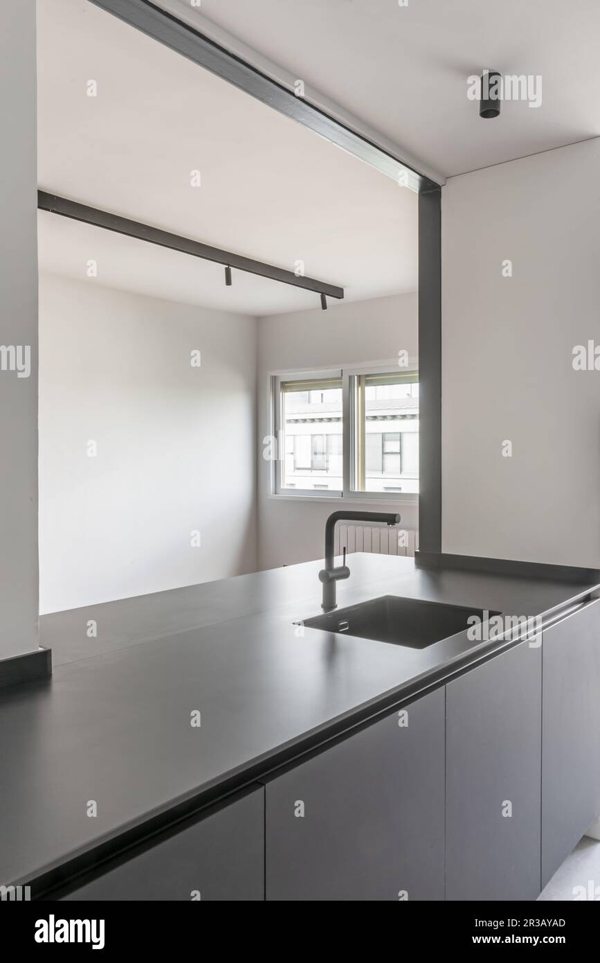 Newly installed modern kitchen cabinets with a large serving hatch open ...