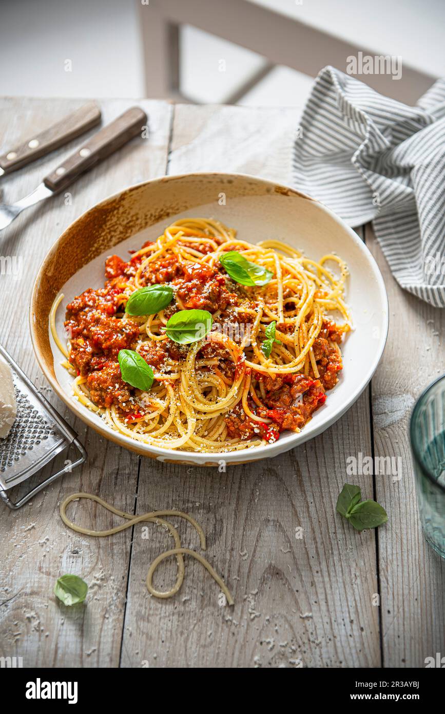 Spaghetti with bolognese sauce, parmesan cheese and basil Stock Photo ...