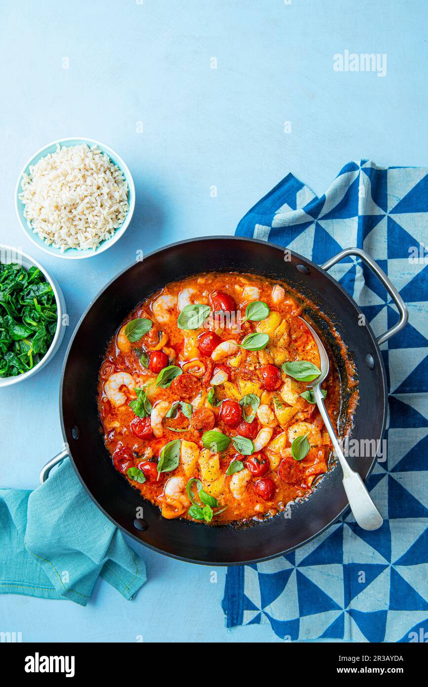 Mediterranean fish and prawn stew with chorizo sausage, cherry tomatoes ...