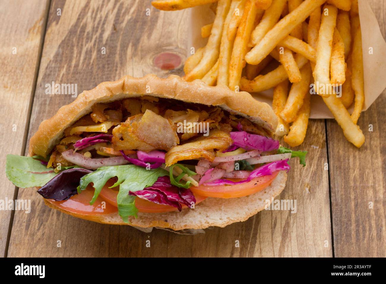Beef doner, French fries, tomato, greens, arugula, cabbage Stock Photo ...