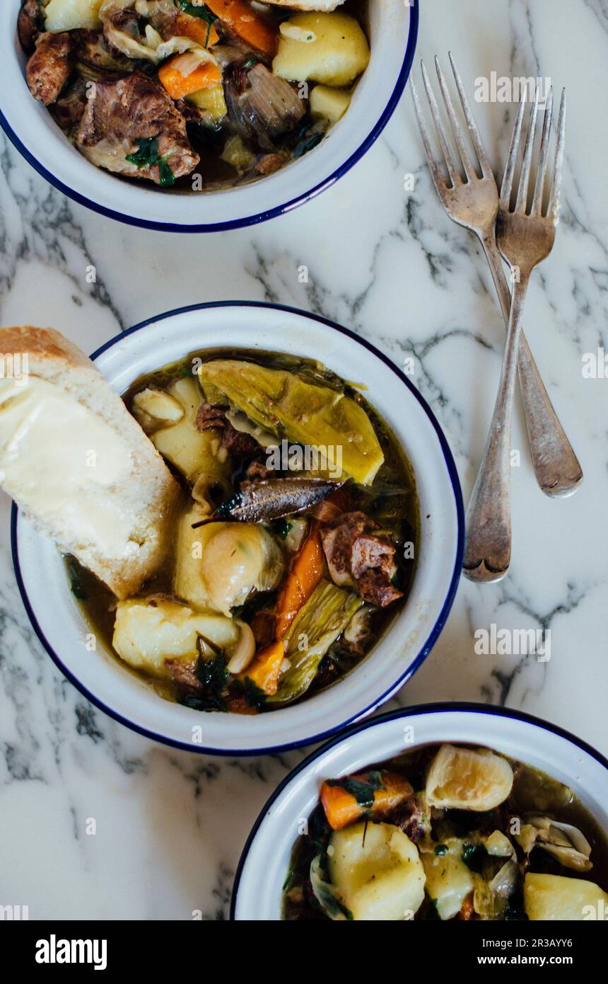 Beef stew with leek, potatoes, carrots, shallots and thyme Stock Photo ...