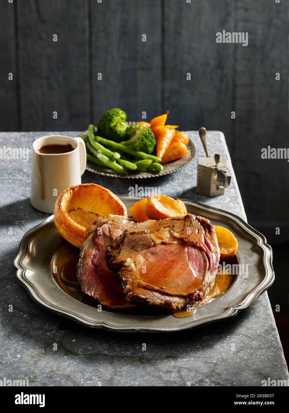 Beef rib roast with Yorkshire puddings and vegetables (England Stock ...