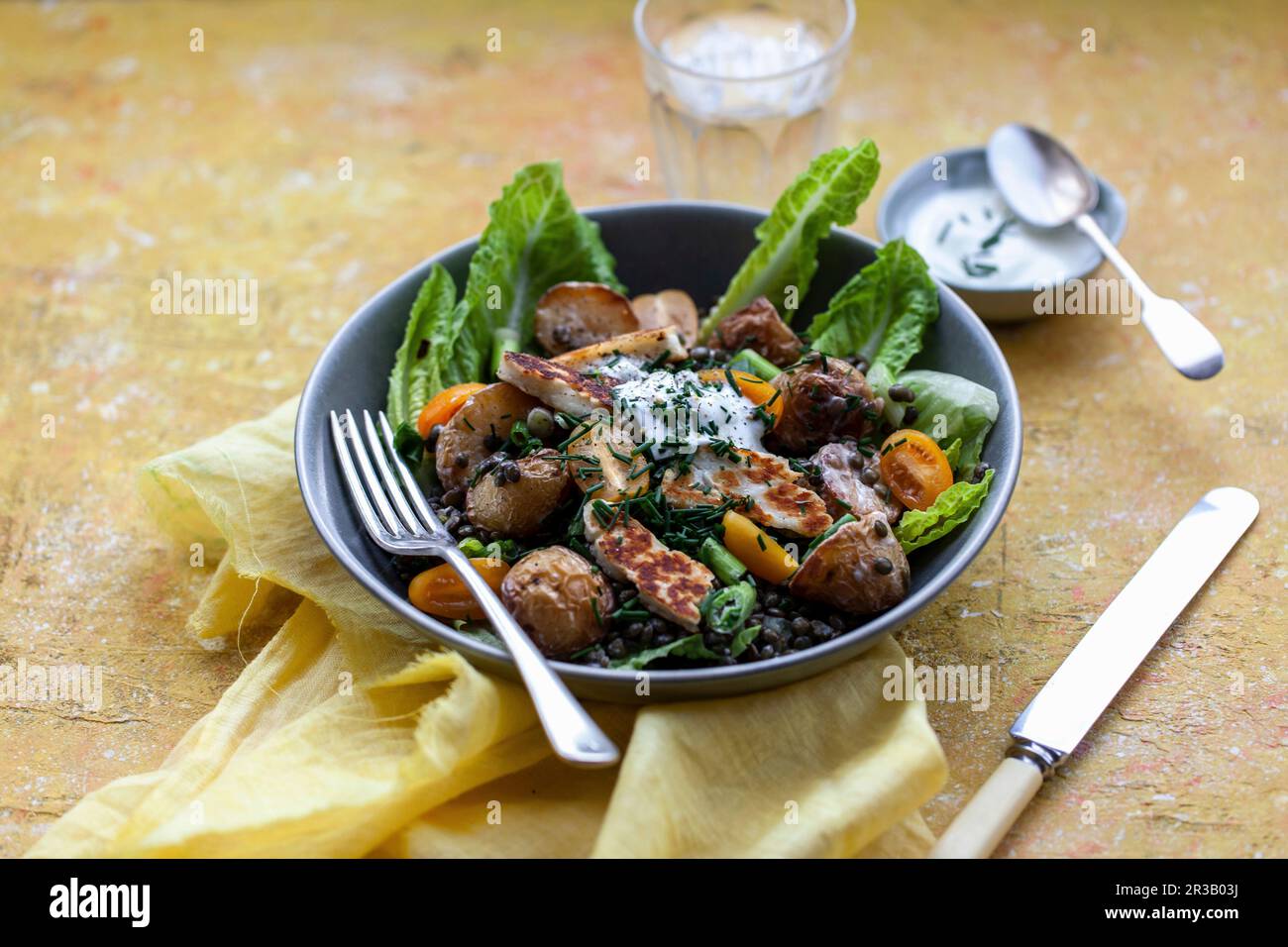 Roast potates with halloumi, lentil and romaine lettuce Stock Photo - Alamy