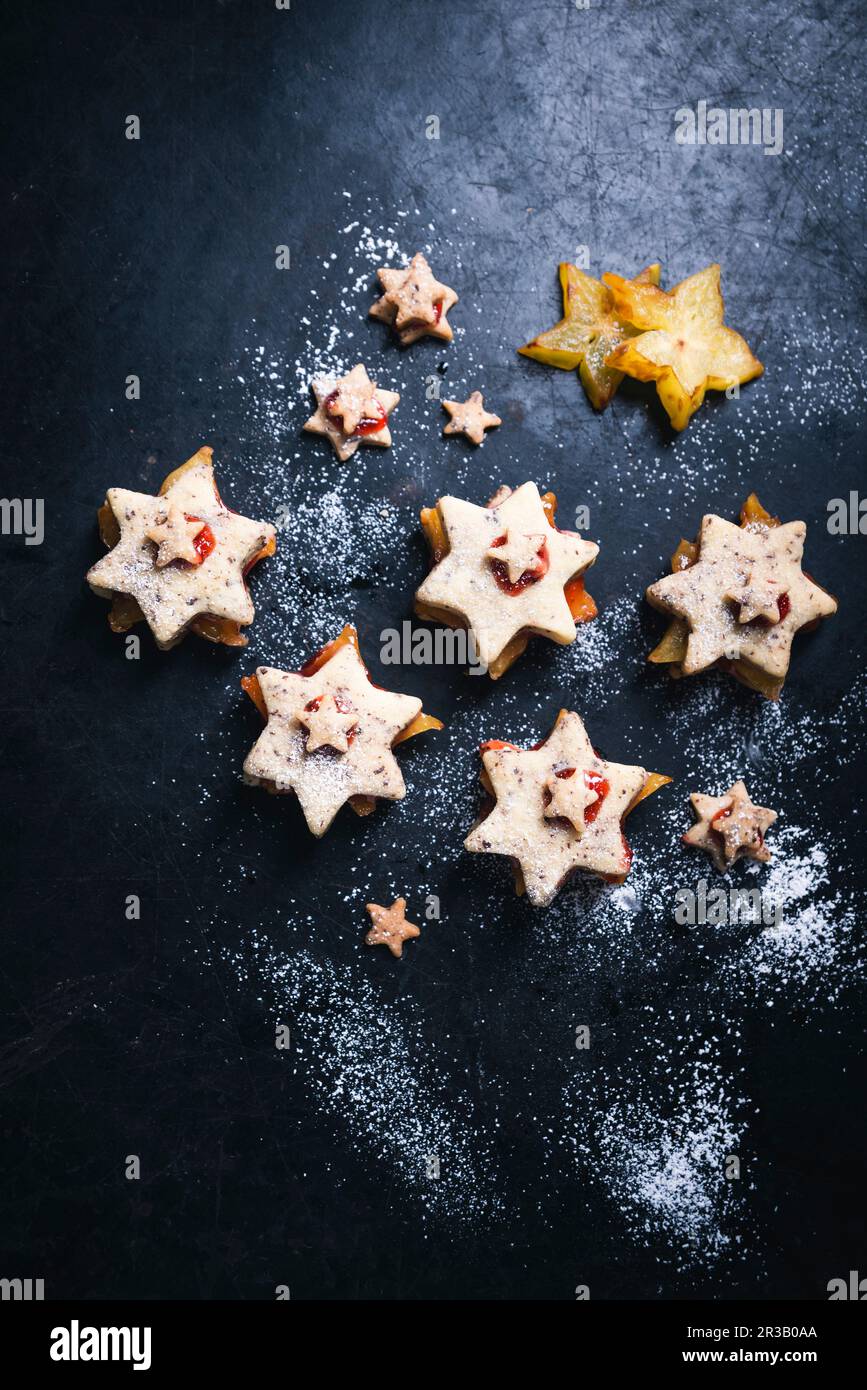 Vegan almond biscuits filled with star-fruit and jam Stock Photo - Alamy