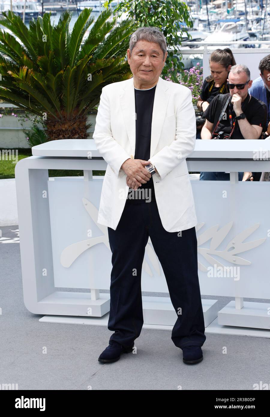 Director Takeshi Kitano poses for photographers at the photo call for ...