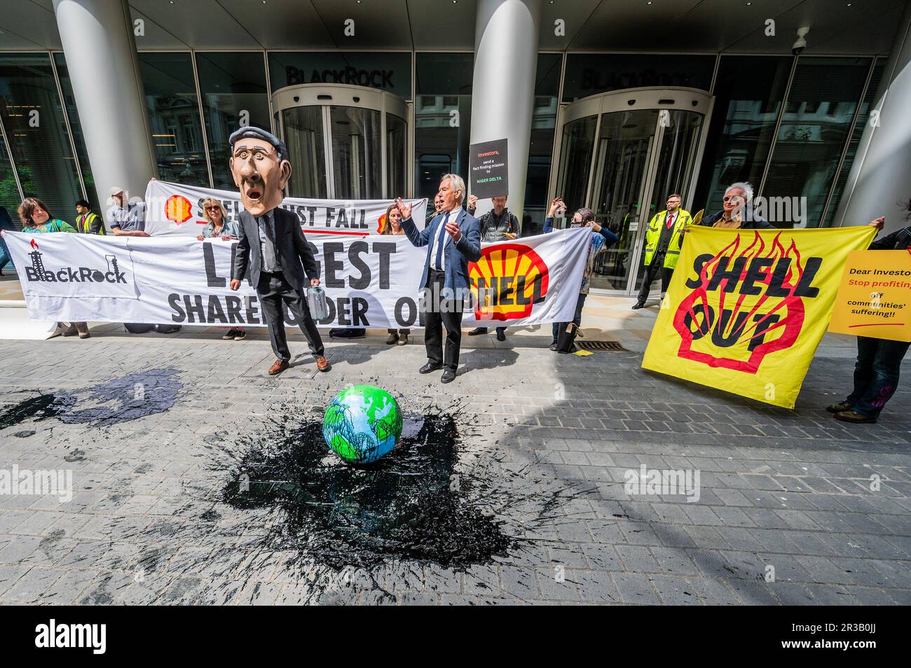 London, UK. 23rd May, 2023. A man a Rishi Sunak mask pours oil over the ...