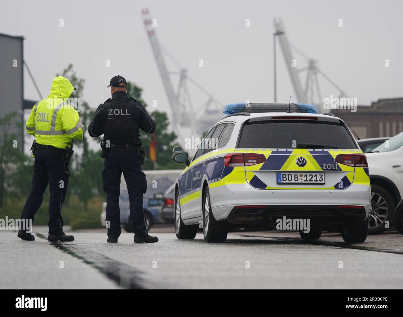 Hamburg, Germany. 23rd May, 2023. Customs officers stand next to their ...