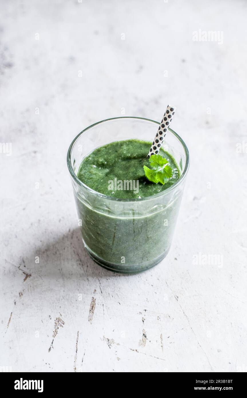 Green smoothie made with mango, banana, orange juice, cilantro, ginger ...