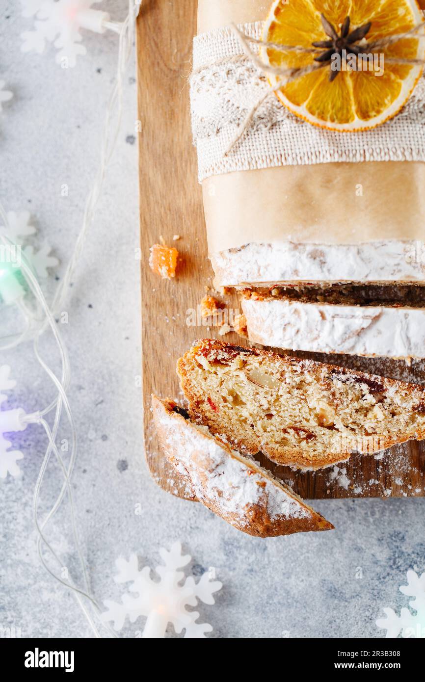 Holiday baking. Christmas cake. Stollen is fruit bread of nuts, spices ...