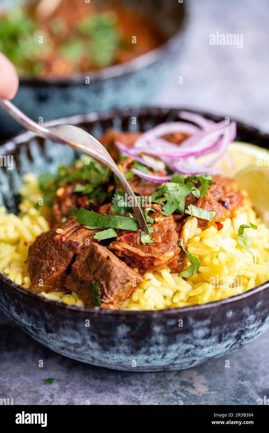 Beef curry with saffron rice Stock Photo - Alamy