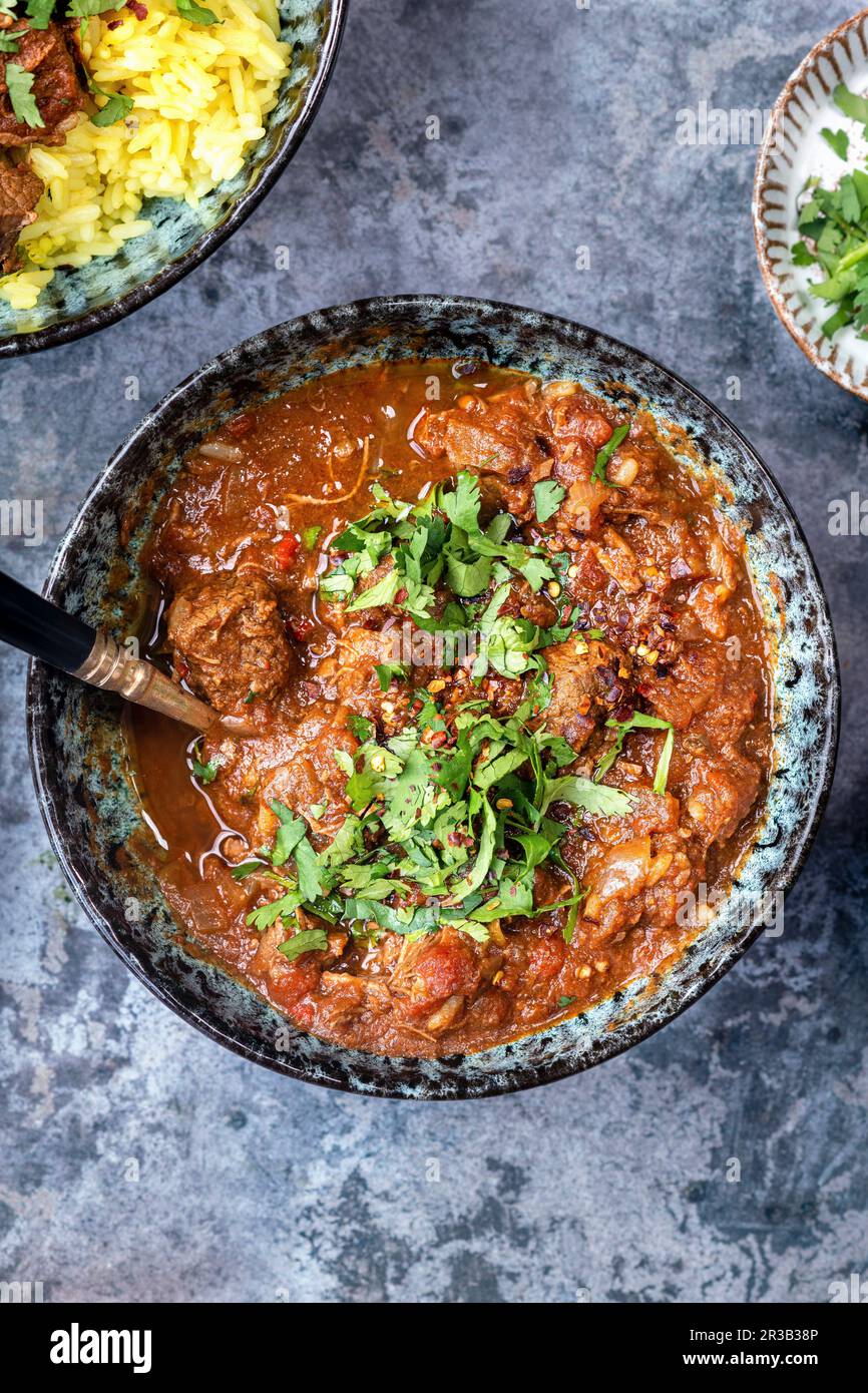Beef curry with saffron rice Stock Photo - Alamy