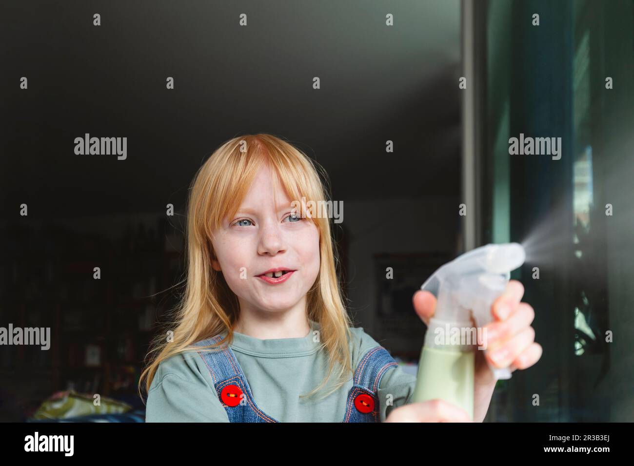 Redhead girl spraying chemical from spray bottle Stock Photo - Alamy Redhead girl spraying chemical from spray bottle Stock Photo - Alamy