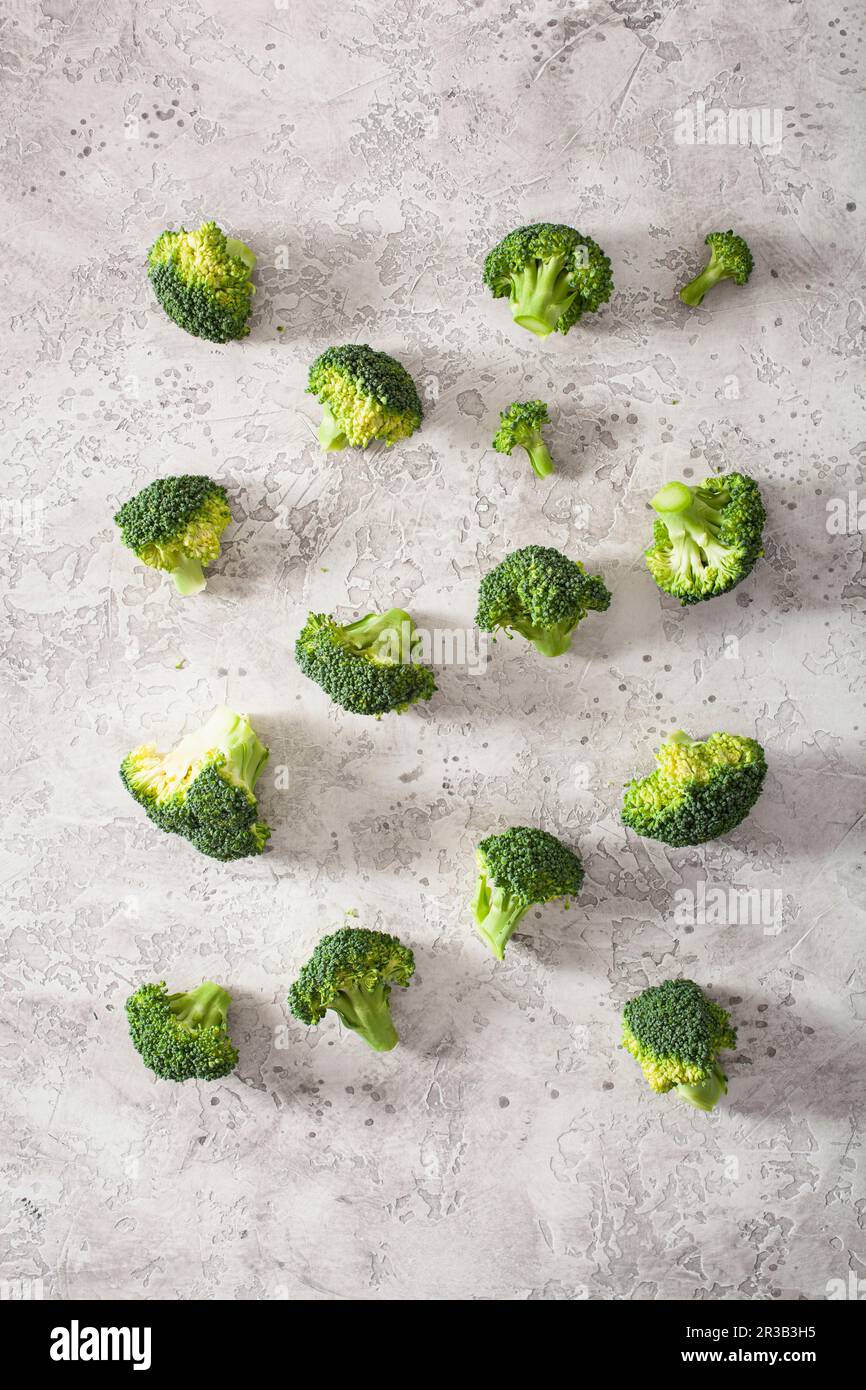 Broccoli florets on a grey surface Stock Photo - Alamy