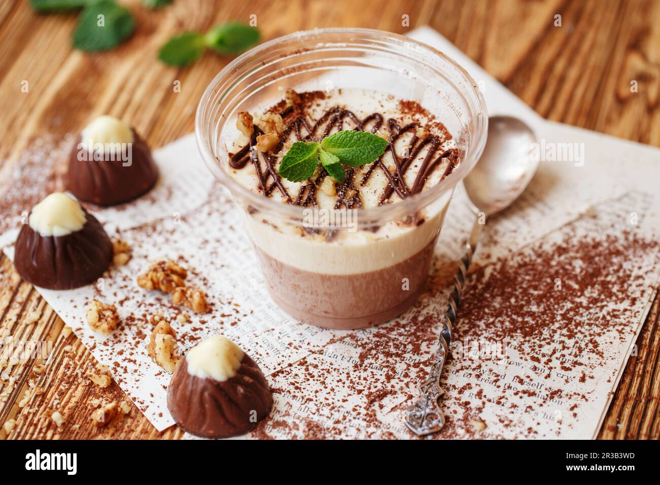 Italian dessert Panakota with mint on a wooden background. Creamy milk ...