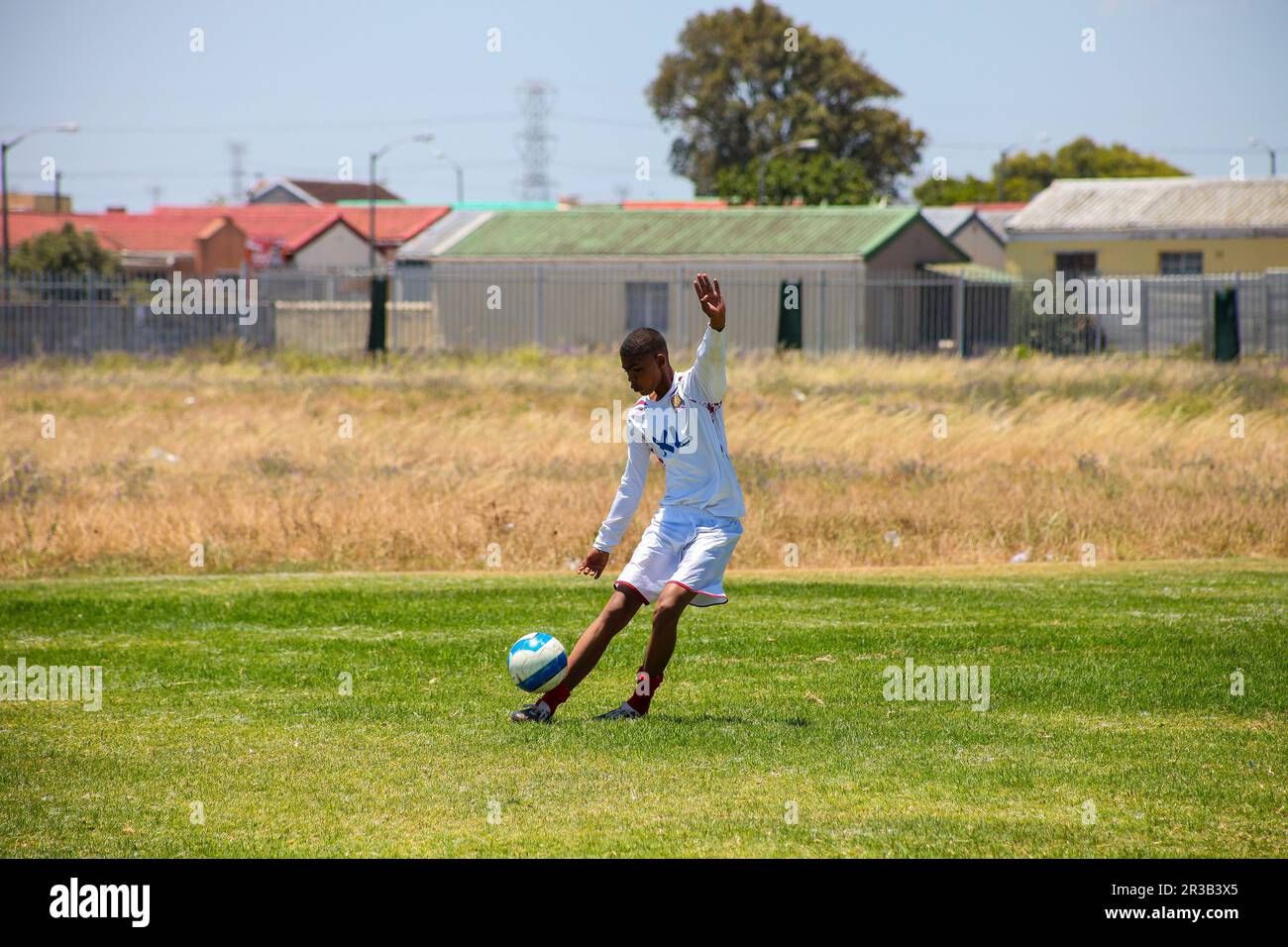 Diverse children playing soccer football at school Stock Photo - Alamy