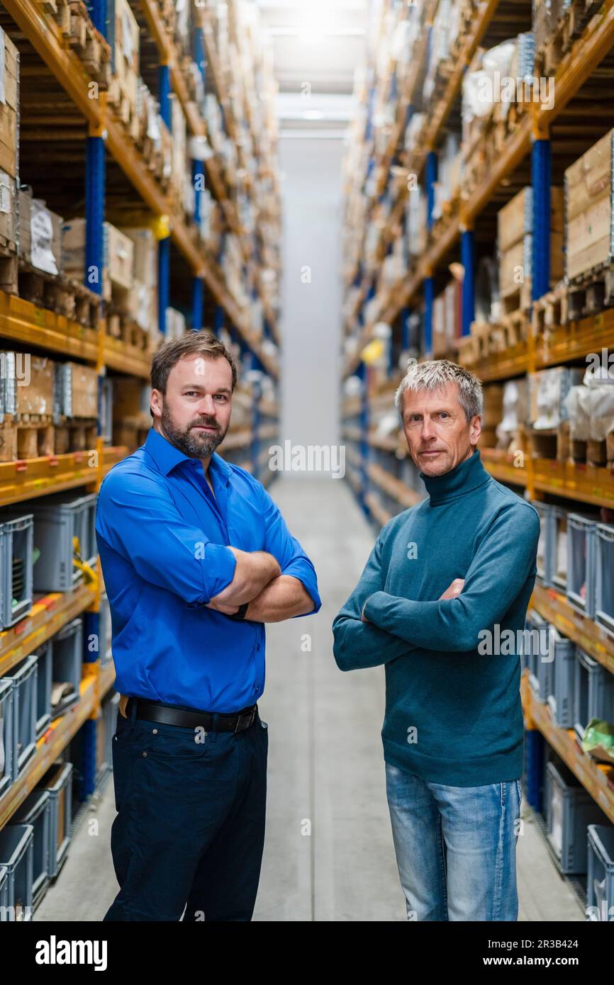 Portrait warehouse team standing arms hi-res stock photography and ...