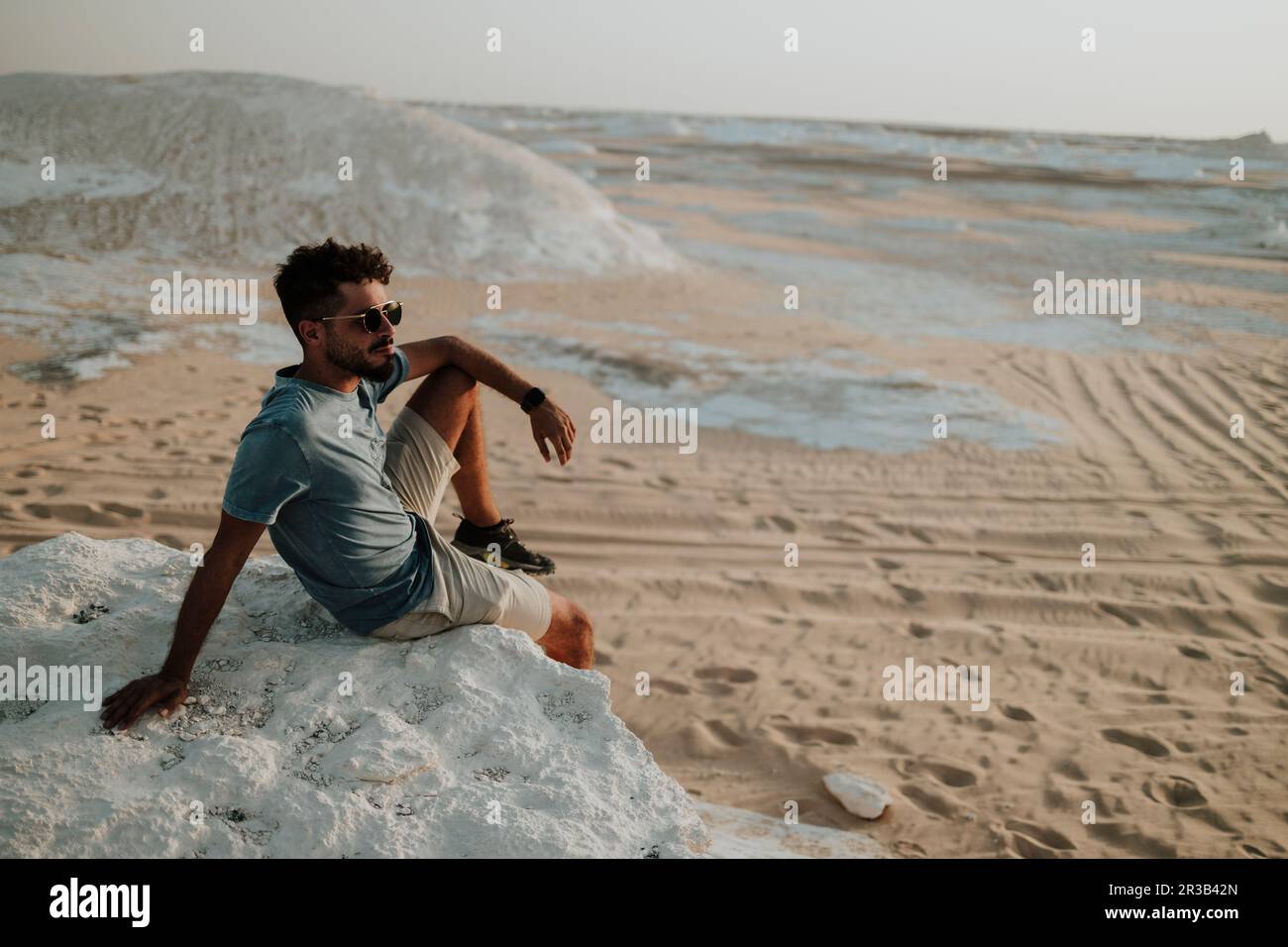 Desert person sitting hi-res stock photography and images - Alamy