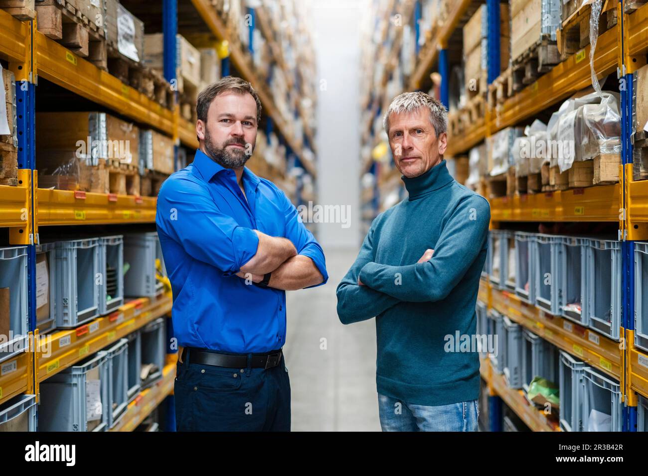 Portrait warehouse team standing arms hi-res stock photography and ...