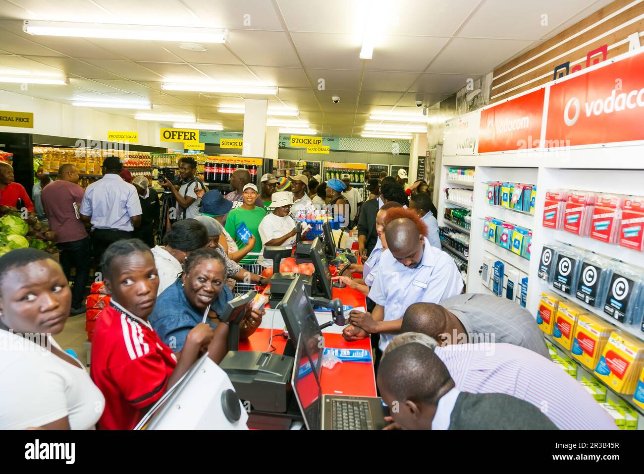 African cashier and customer at checkout at local Pick n Pay grocery ...